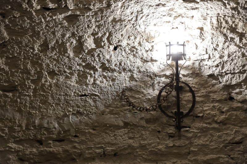 Lighted Medieval Castle Torch Hanging on a Stone Wall, Vintage Objects ...