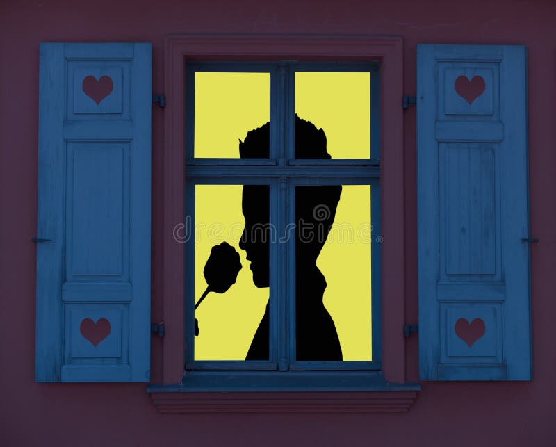 Lighted Window Frame with a Silhouette of a Couple Making Love on a ...