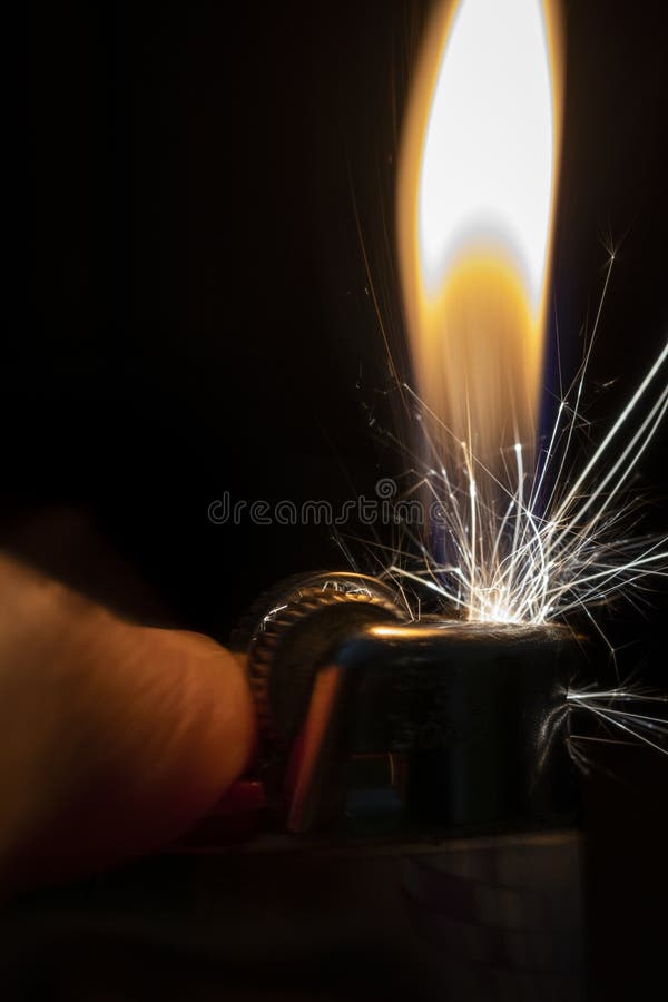 A Lighter Being Lit in the Dark Stock Image - Image of candle, cool ...
