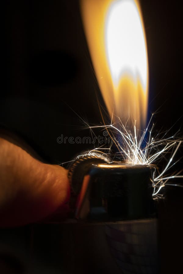 A Lighter Being Lit in the Dark Stock Image - Image of beautiful ...