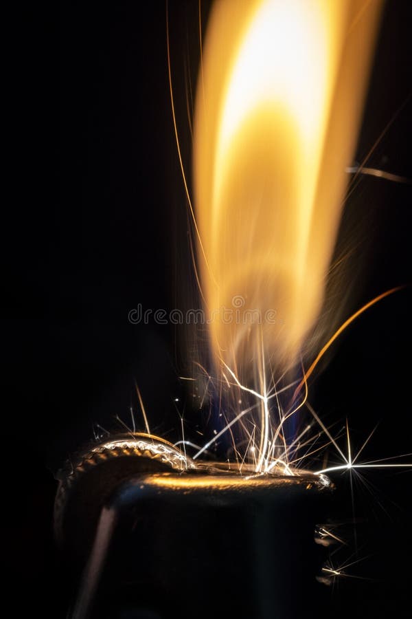 A Lighter Being Lit in the Dark Stock Photo - Image of detail, crystal ...