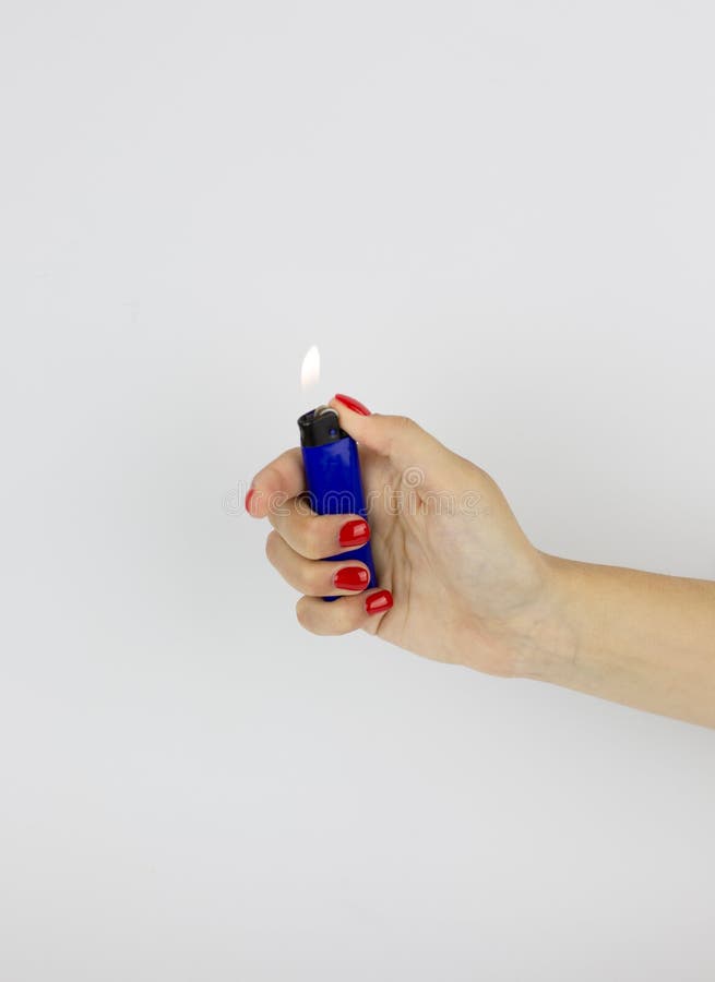 Red Lighter with Fire in Woman`s Hand with Red Nails on White ...