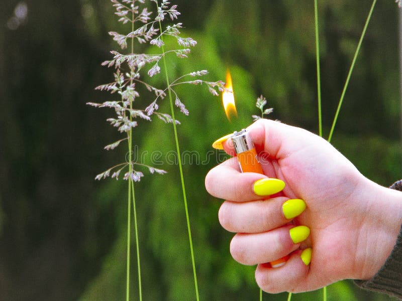 Lighter in Girl& X27;s Hand Stock Photo - Image of nature, girl: 188920356