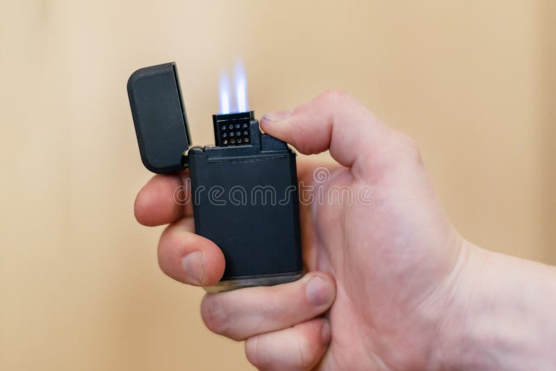 Lighter with a Two Blue Flames - Hand Holds Lighter Stock Photo - Image ...