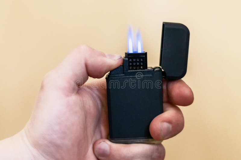 Lighter with a Two Blue Flames - Hand Holds Lighter Stock Image - Image ...