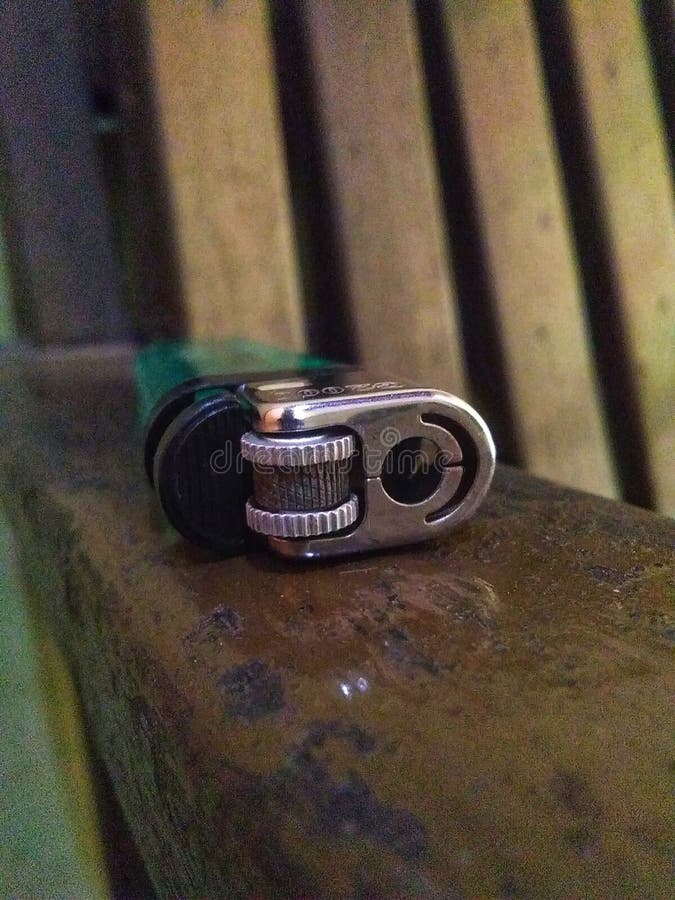 Lighter on a wooden chair stock photo. Image of wooden - 239455060