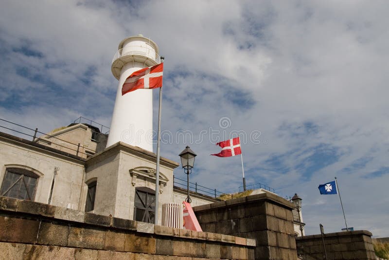 Lighthouse stock image. Image of trekroner, flag, clouds - 6164467
