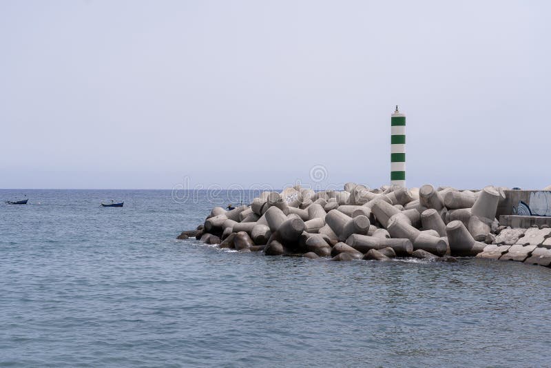 Lighthouse on an Artificial Breakwater Stock Photo - Image of landscape ...