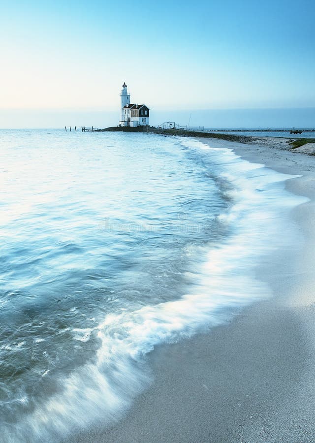 Lighthouse and beach stock image. Image of coast, gold - 923101