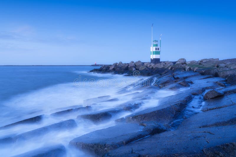 A Lighthouse on the Beach during Blue Hour. a Landmark in Maritime ...