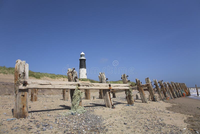 Lighthouse and Beach Groynes Stock Photo - Image of lighthouse ...