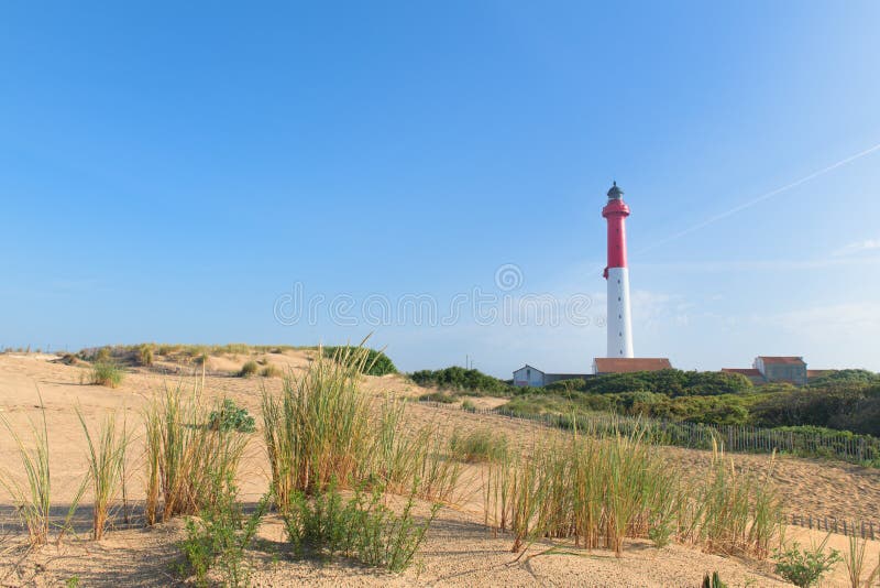Lighthouse at the beach stock photo. Image of landscape - 95539818