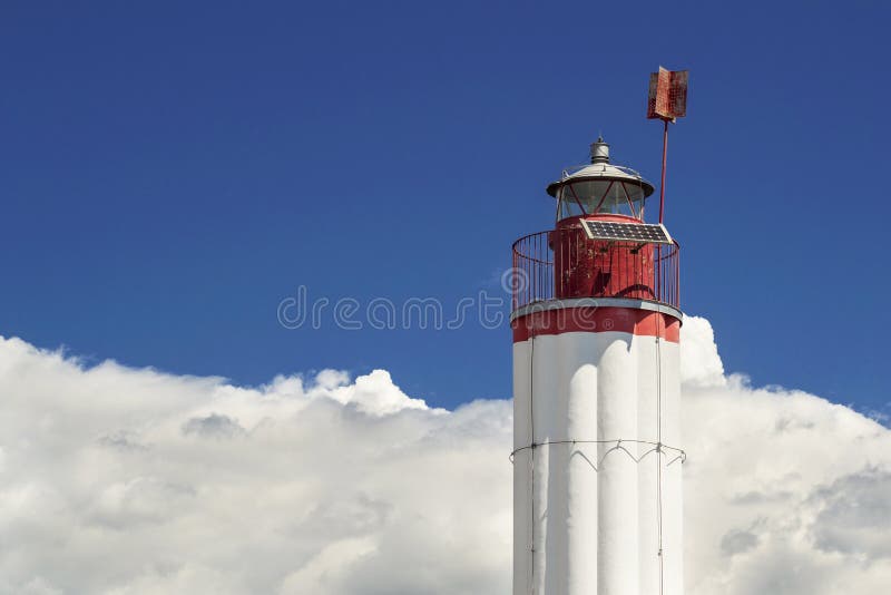 Lighthouse with blue sky stock photo. Image of cloud, water - 1097004