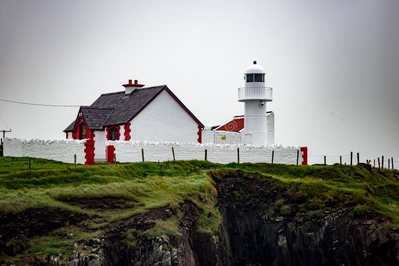The Lighthouse on a Cliff in Dingle, Ireland Stock Photo - Image of ...