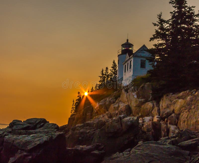 Lighthouse on the cliff stock photo. Image of sunset - 100425162
