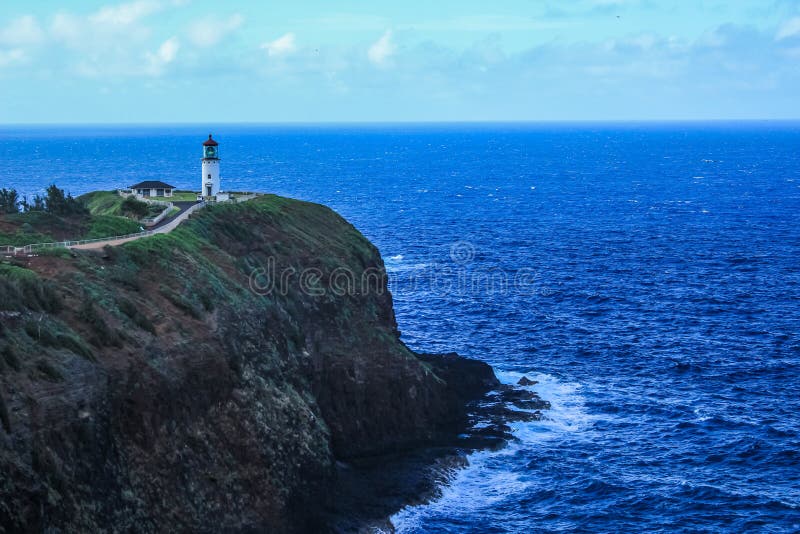 Rock Cliff with Lighthouse beside the Sea Stock Photo - Image of ...
