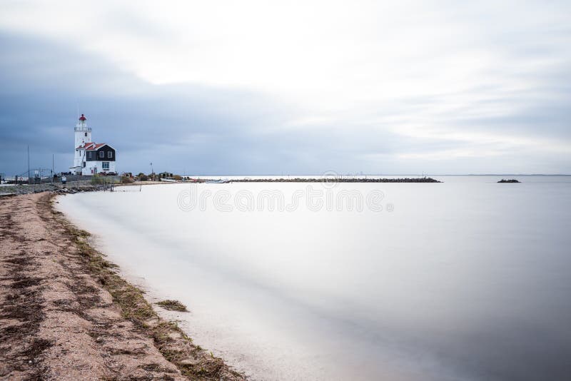 Lighthouse on a cloudy day stock photo. Image of europa - 103420308