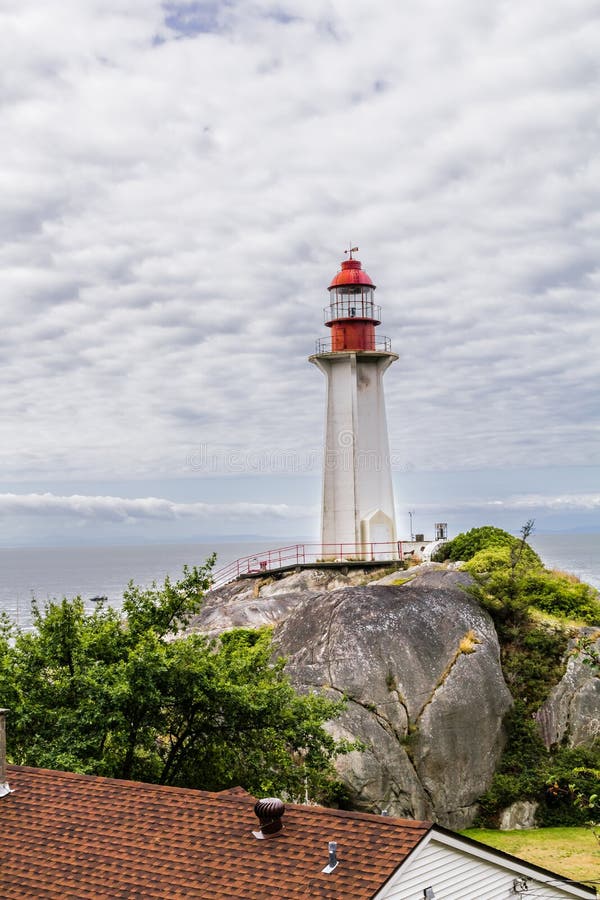 Lighthouse on a cloudy day stock photo. Image of light - 76771424