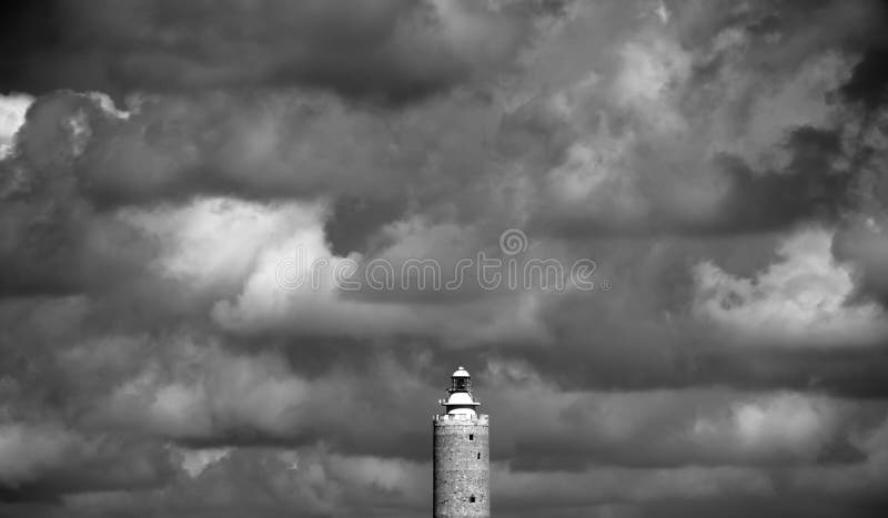 Lighthouse with cloudy sky stock photo. Image of shot - 179220684