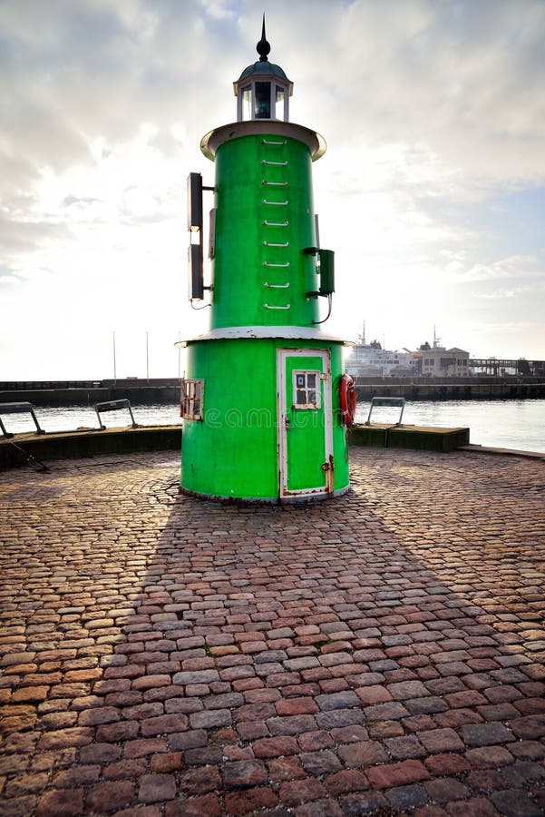 Lighthouse on the coast stock photo. Image of polarize - 76323196