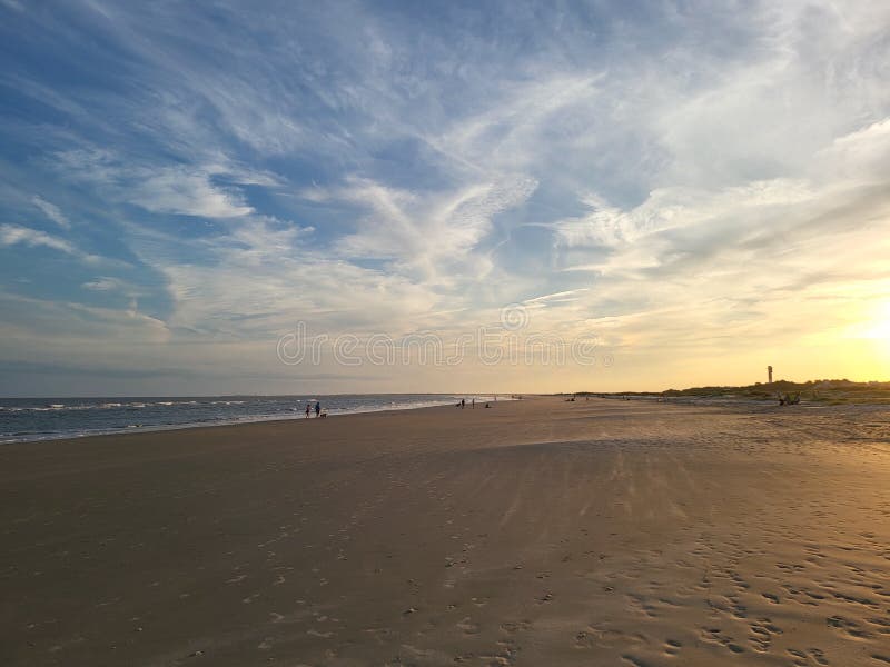Lighthouse Coast Skyline Low Tide Stock Image - Image of beach, wave ...