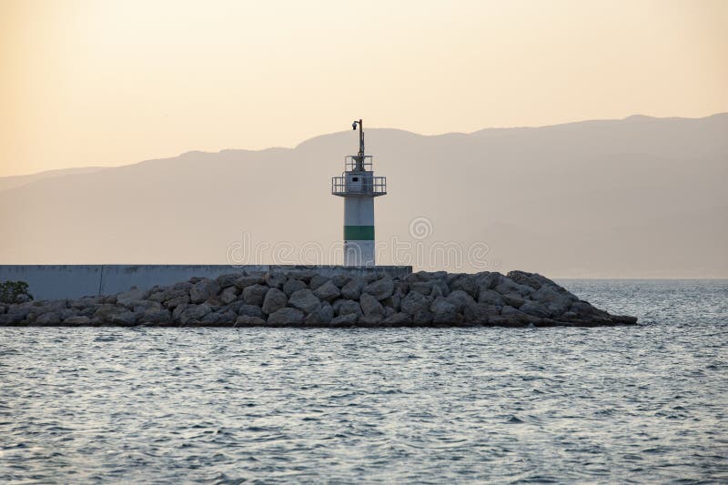 Lighthouse on the Coast at Sunset. Lighthouse in the Harbour Stock ...
