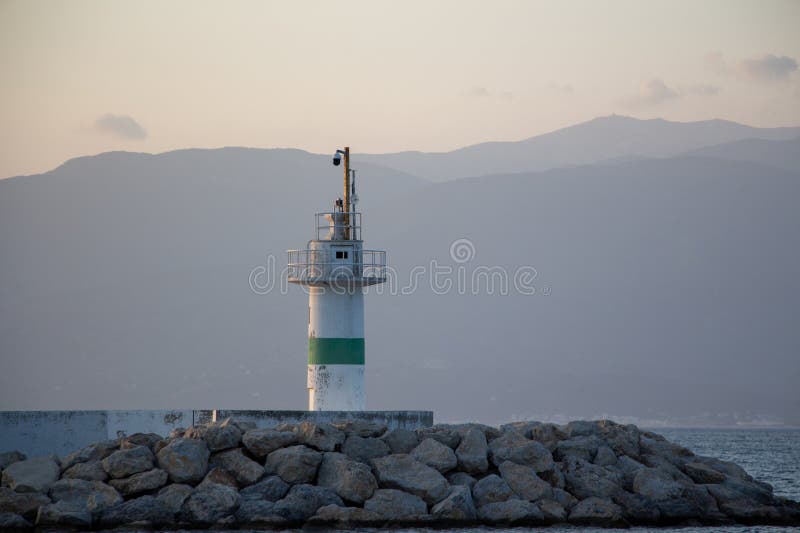 Lighthouse on the Coast at Sunset. Lighthouse in the Harbour Stock ...