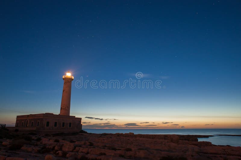Lighthouse at dawn stock photo. Image of dusk, seascape - 55349854
