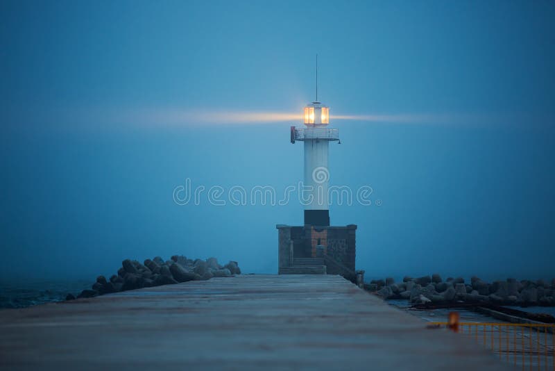 Lighthouse in Dense Fog and Mist, Night Scene Stock Photo - Image of ...