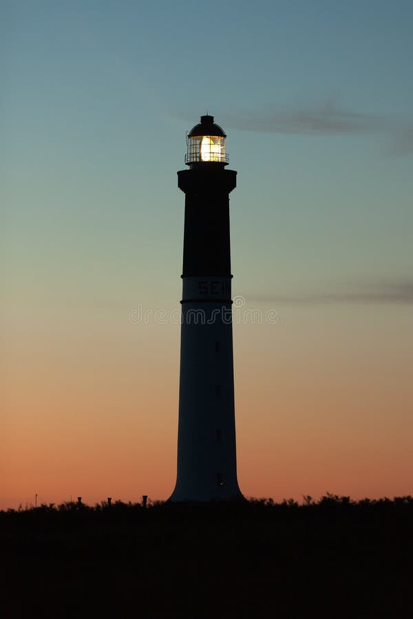 Barnegat Lighthouse at Dusk Stock Photo - Image of lighthouse, sail ...