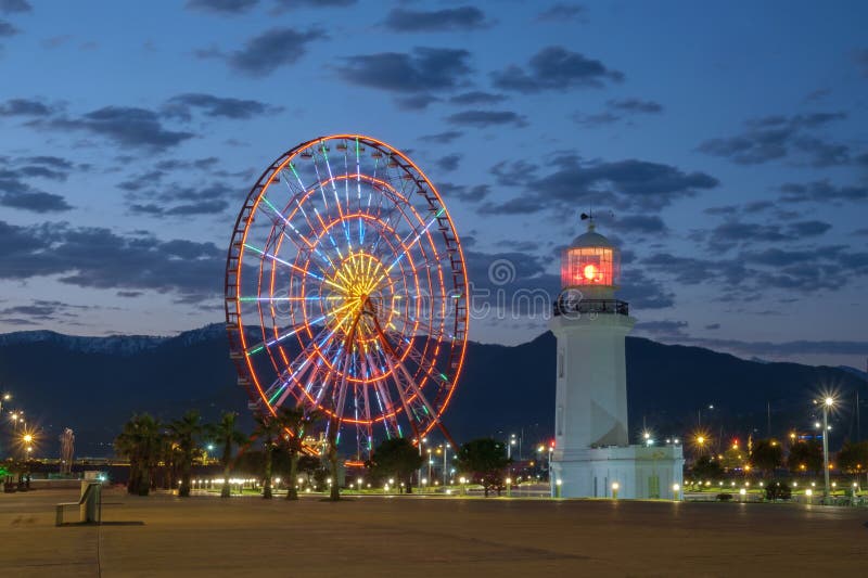 Lighthouse and Ferris Wheel Stock Image - Image of outdoor, daybreak ...