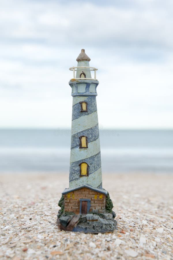 Lighthouse Figure on the Beach in the Evening Stock Photo - Image of ...