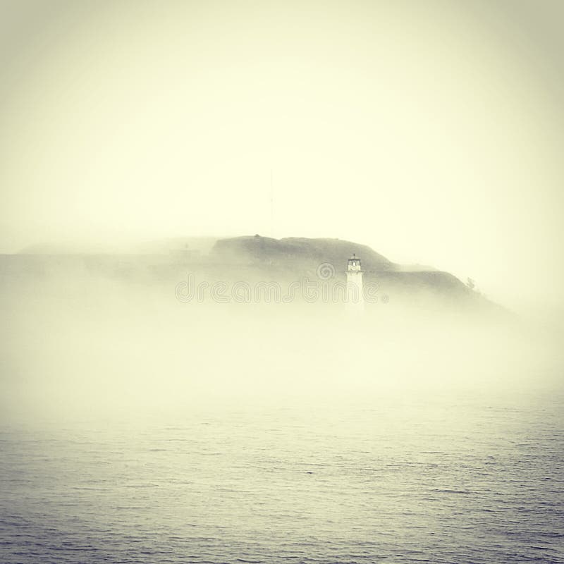 Lighthouse in Fog stock image. Image of water, island - 186708039