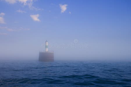Lighthouse in fog stock image. Image of water, naval, limited - 3602149
