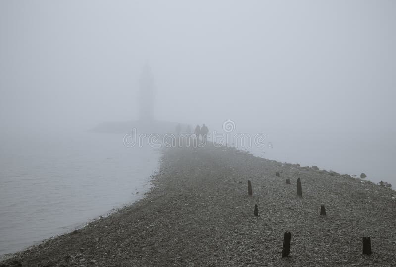 Lighthouse in fog stock image. Image of monochrome, people - 7151431
