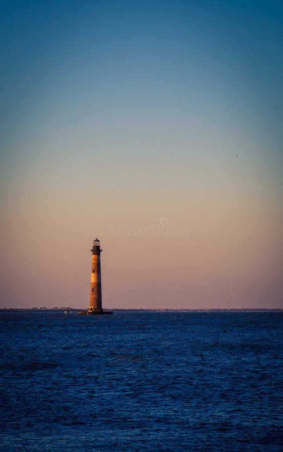 Lighthouse at folly beach stock image. Image of water - 113900985