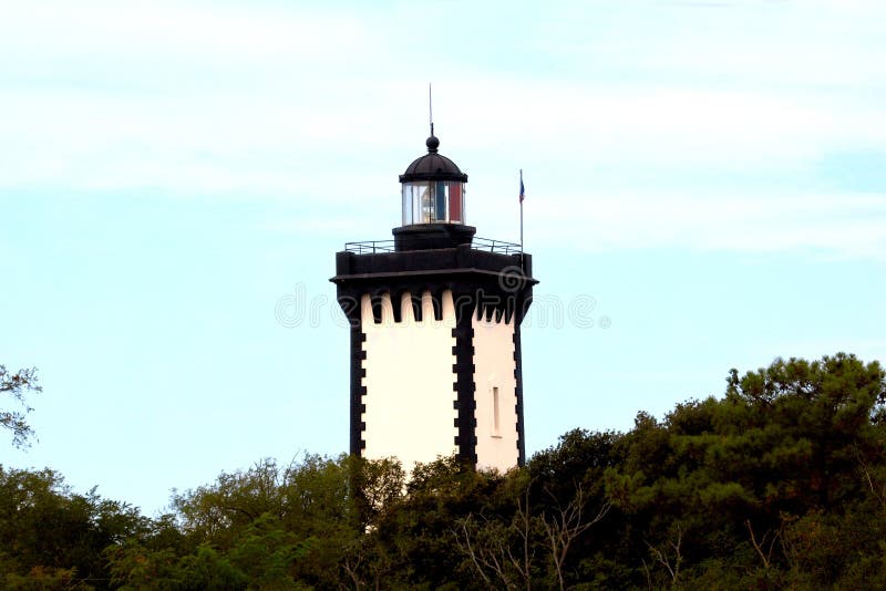 White Lighthouse in the Forest Stock Image - Image of lantern, stone ...