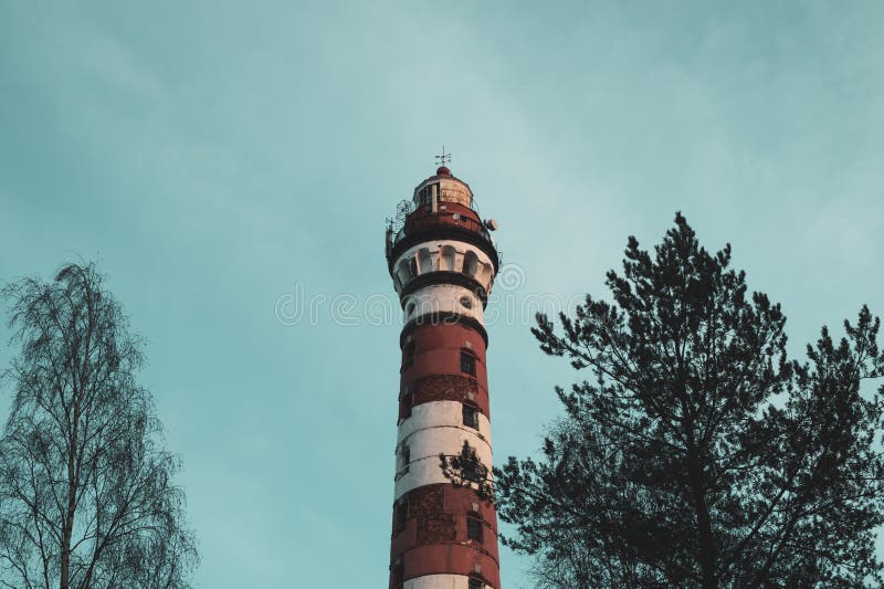 Lighthouse in the Forest among the Trees. Red and White Lighthouse ...