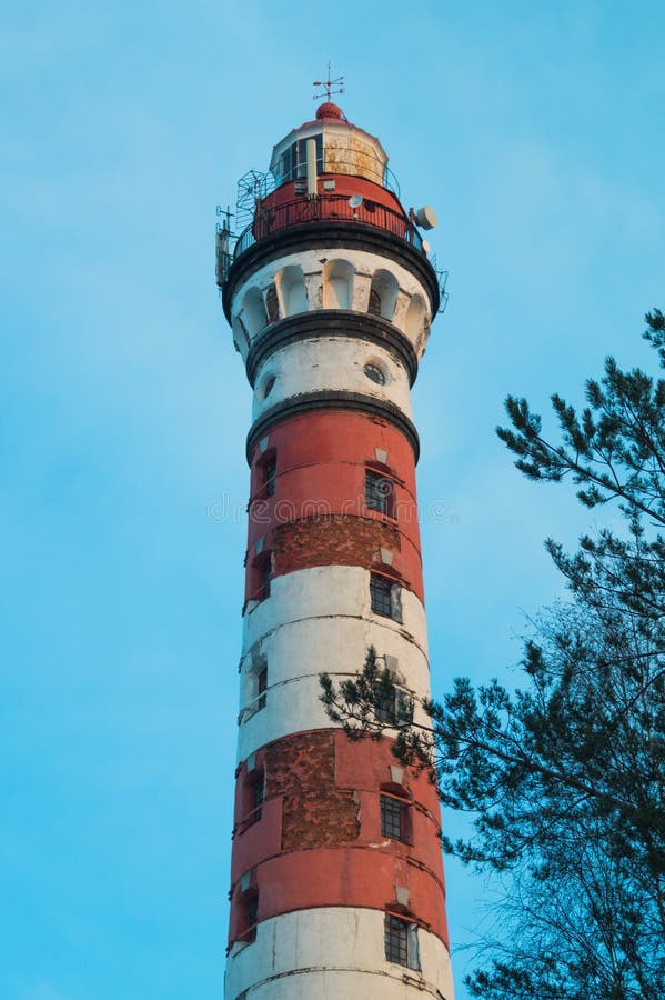 Lighthouse in the Forest among the Trees. Red and White Lighthouse ...