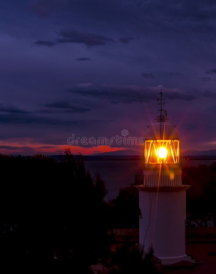 The Lighthouse Glowing at Dark Night on Coast Spain Stock Image - Image ...