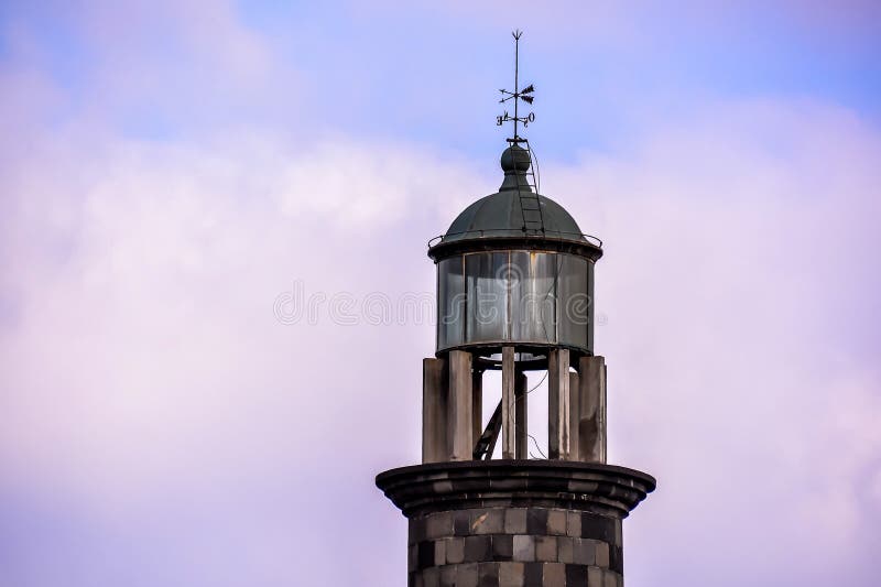 A Lighthouse with a Green Dome Sits Atop a Tall Tower Stock Photo ...