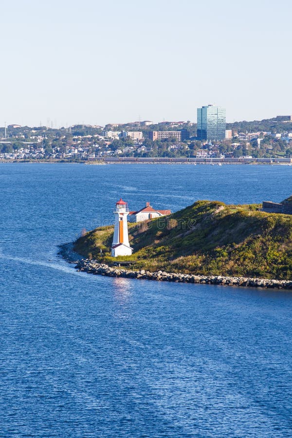 Lighthouse on Green Point Over Blue Water Stock Photo - Image of tower ...