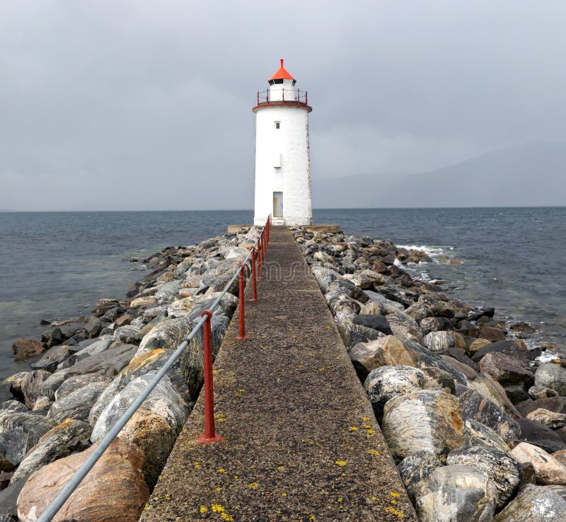 Lighthouse and jetty stock photo. Image of security - 205130932