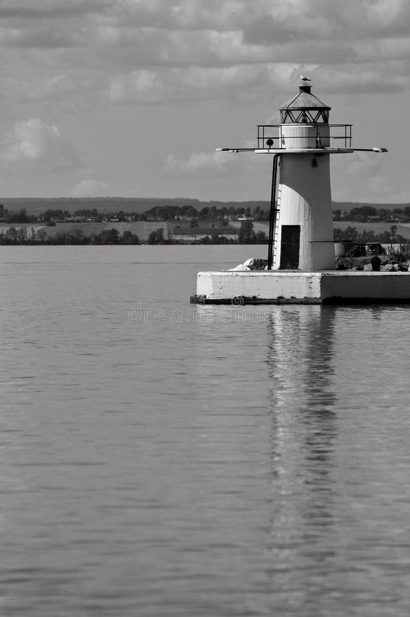 A Lighthouse by a Lake during Summer Stock Photo - Image of seagull ...