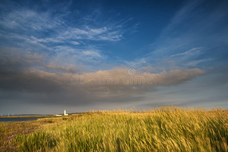 Lighthouse in Landscape Under Dramatic Stormy Sky Sunset in Summer ...