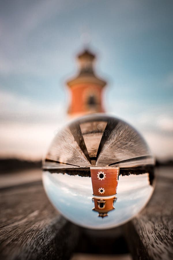 Lighthouse in a lensball stock image. Image of wood - 279920873