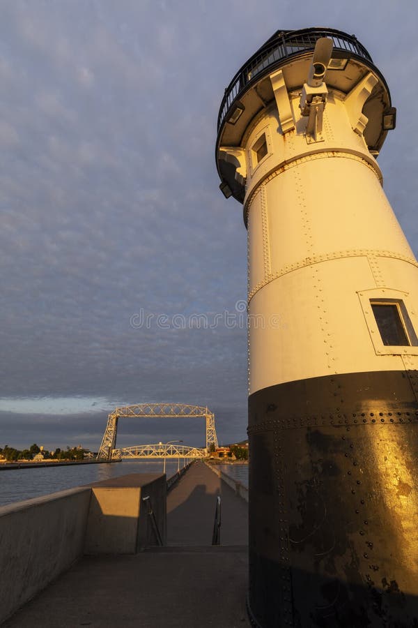 Lighthouse and a Lift Bridge Stock Photo - Image of canal, evening ...
