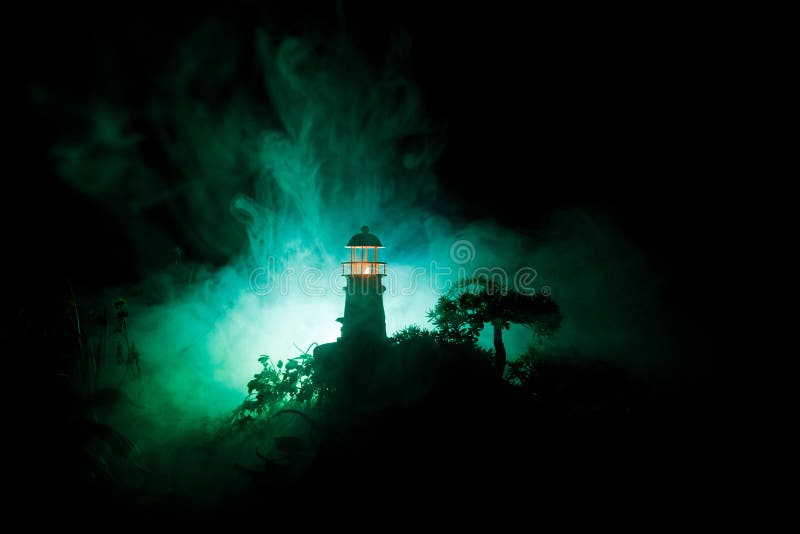 Lighthouse with Light Beam at Night with Fog. Old Lighthouse Standing ...