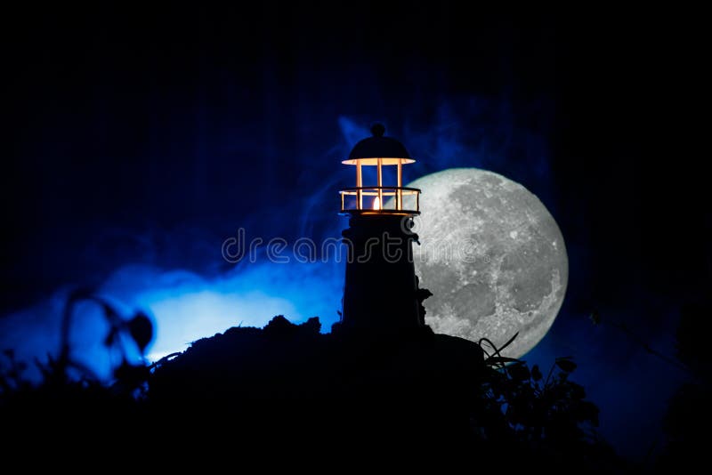 Lighthouse with Light Beam at Night with Fog. Old Lighthouse Standing ...