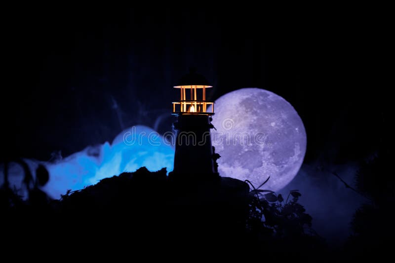 Lighthouse with Light Beam at Night with Fog. Old Lighthouse Standing ...